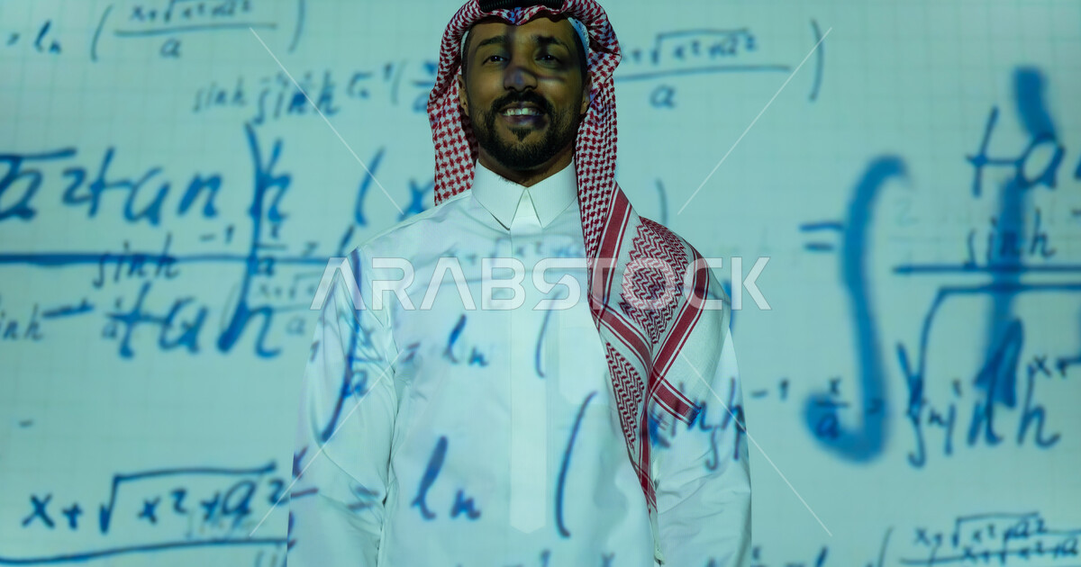 Numbers and calculations in mathematics, a Saudi Gulf Arab man wearing ...