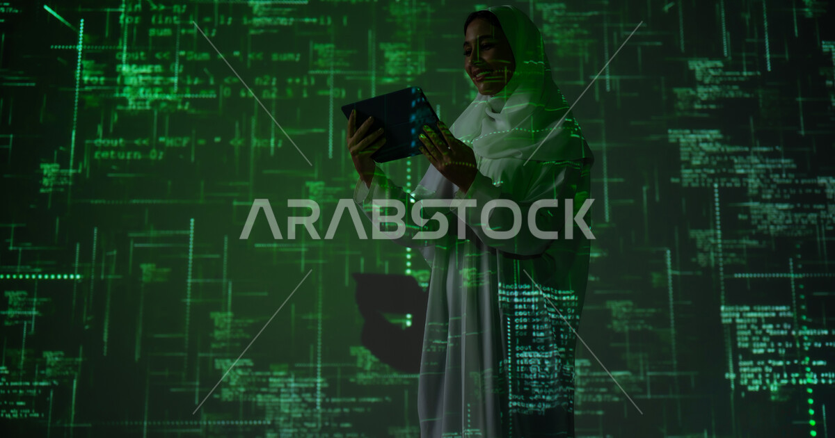 The use of advanced modern technologies, a smiling, veiled Saudi ...