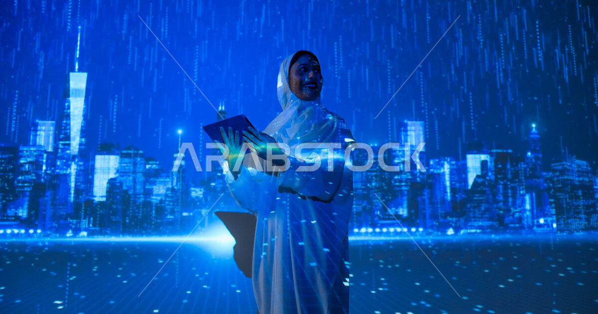 تعابير الفرح والسعادة، استخدام التكنولوجيا الحديثة، امرأة عربية خليجية سعودية مبتسمة محجبة ترتدي ...