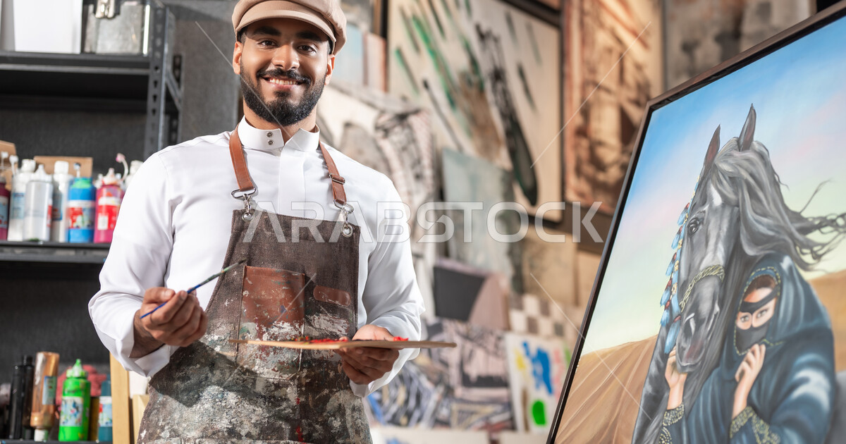 Standing in front of a painting of an Arab woman with horses in the ...