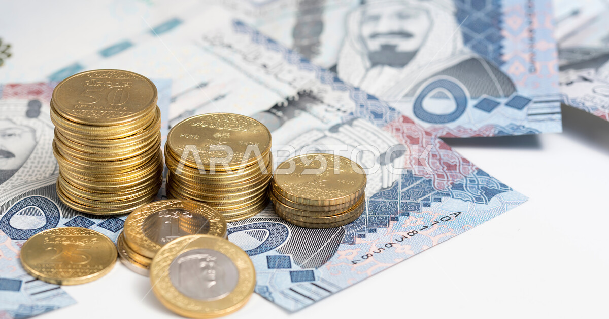 The official currencies of Saudi Arabia, a close-up of a Saudi five ...