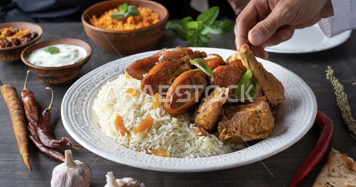 Traditional Arabic popular meals and dishes, a plate of white rice and ...