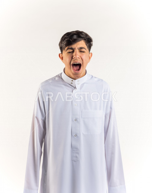 Portrait of a young Saudi Arabian Gulf teenager with different facial ...