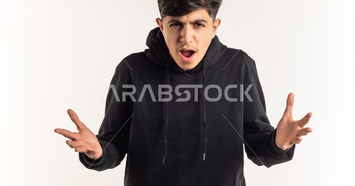 Portrait of a young Saudi Arabian Gulf teenager with different facial ...