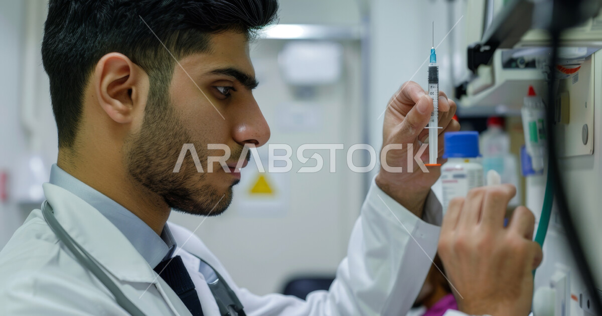 Attention and care for patients, a Saudi Gulf Arab doctor adjusts the ...