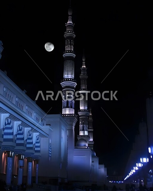 Minarets of the Grand Mosque in Mecca at night, view of the full moon ...
