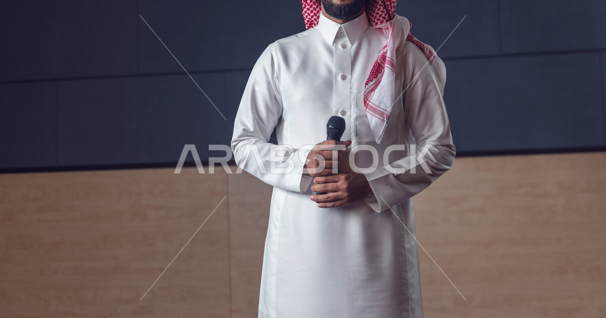 A Saudi Gulf theater presenter on stage, presenting theatrical ...