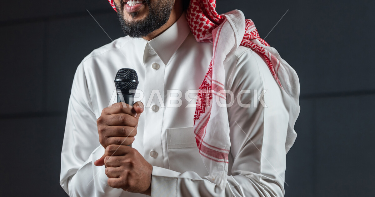 A Saudi Gulf theater presenter on stage, presenting theatrical ...
