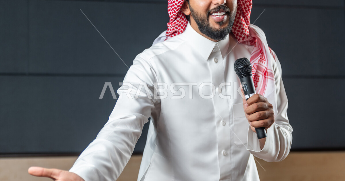 A Saudi Gulf theater presenter on stage, presenting theatrical ...