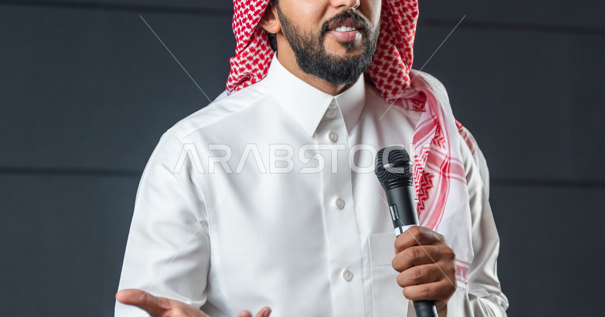A Saudi Gulf theater presenter on stage, presenting theatrical ...