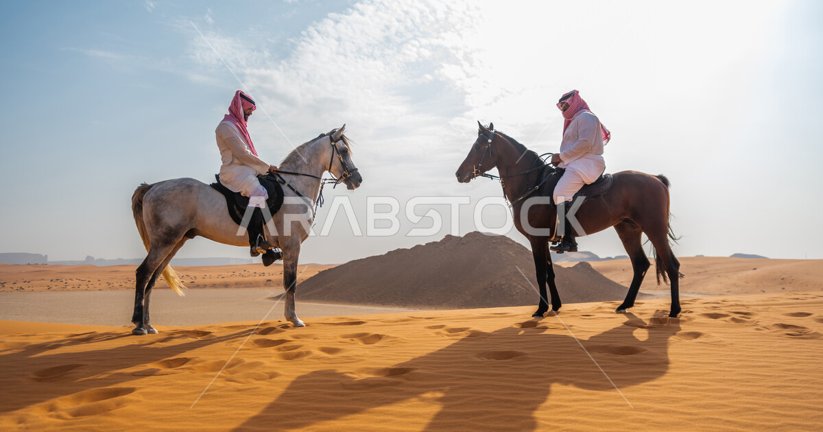 Two Saudi Arabian Gulf riders riding horses in the picturesque Saudi ...