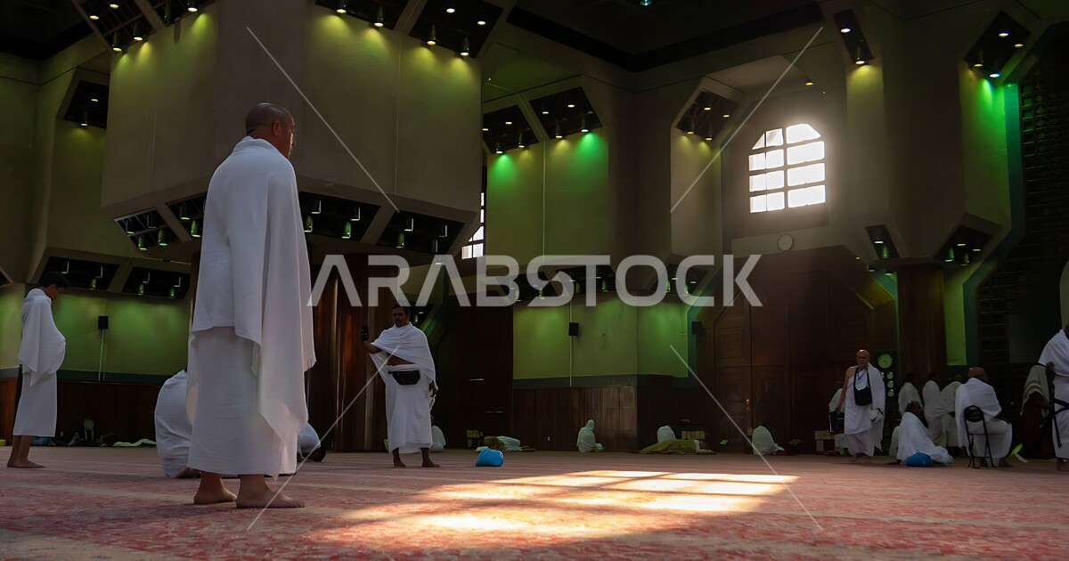 Worshiping and getting closer to God, a group of Muslim pilgrims ...