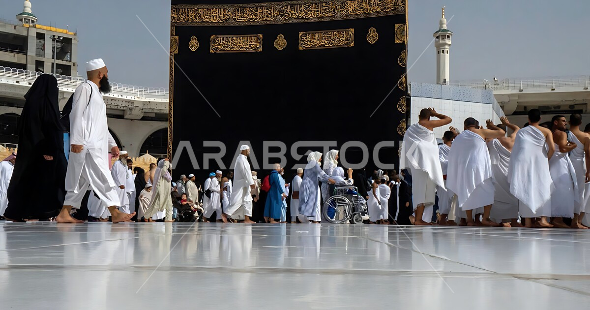 Pilgrims and Umrah performers circumambulating the Kaaba, wearing the ...