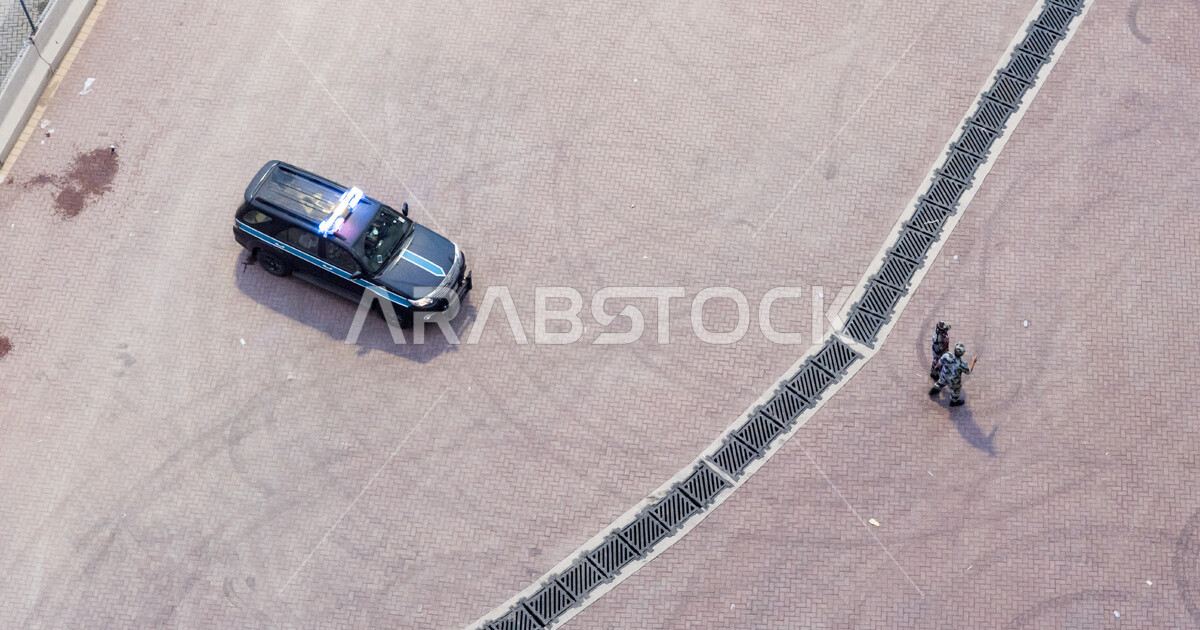 A car and a security man in Medina in the Kingdom of Saudi Arabia, the ...