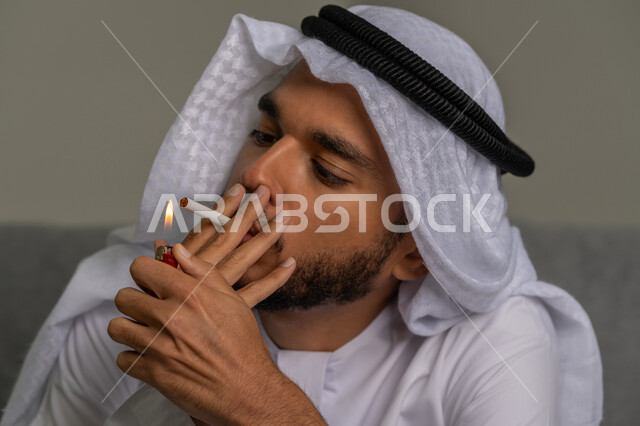 Respiratory diseases, close-up of a young Emirati Gulf Arab man wearing ...