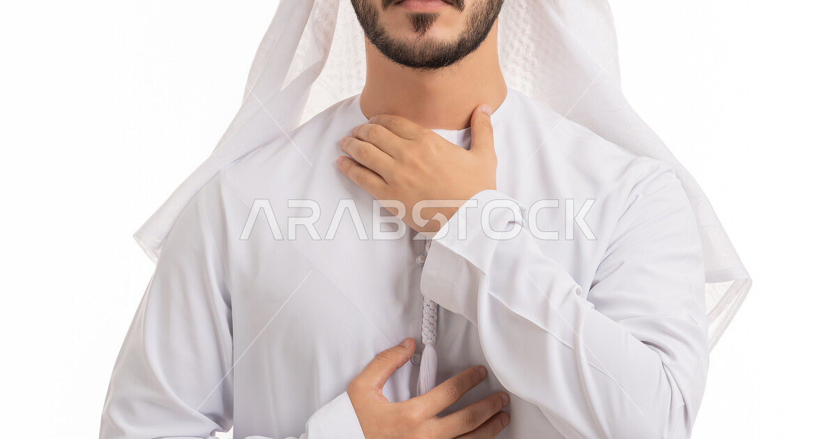 Suffering from a cold and sore throat, portrait of a young Arab Gulf ...