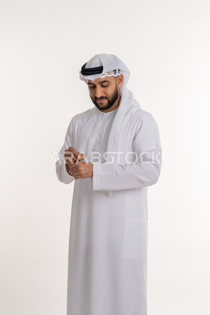 Luxury perfume products, portrait of an Emirati Gulf Arab man wearing a ...