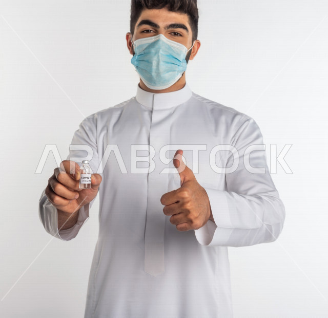 Portrait of a Saudi Arabian Gulf Muslim man in Ihram dress and wearing ...