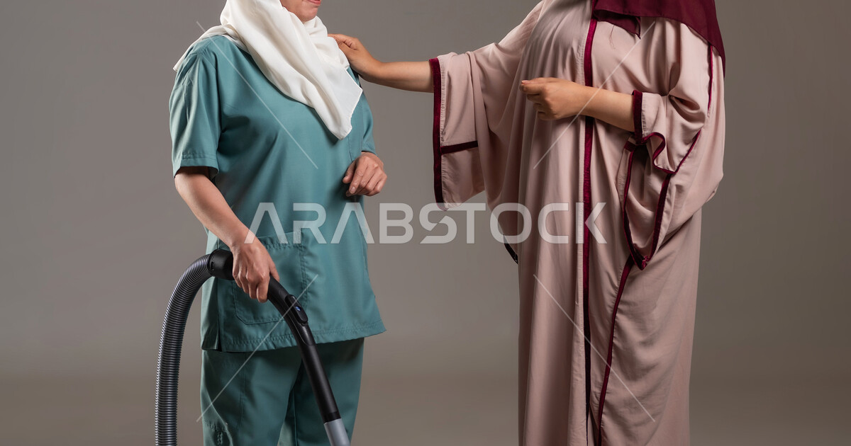 Giving instructions and explaining tasks, a red vacuum cleaner, a ...