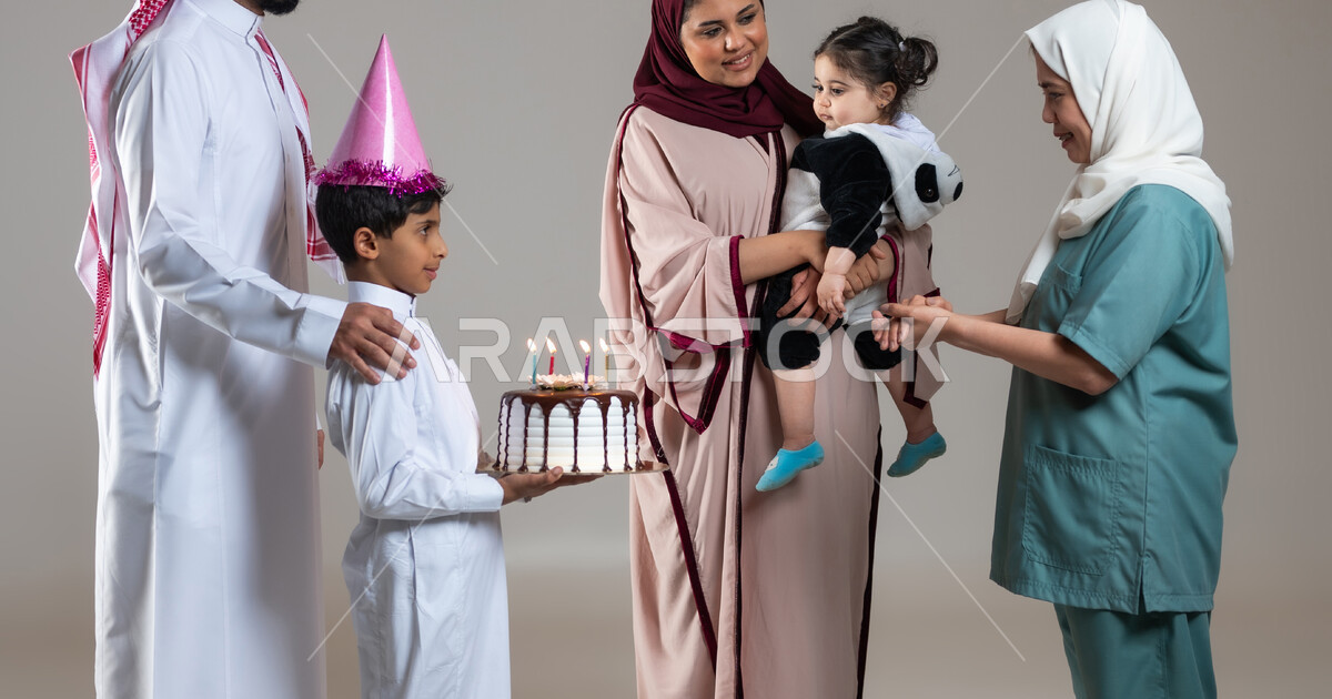 Celebrating birthdays, a portrait of a Gulf Arab family celebrating the ...
