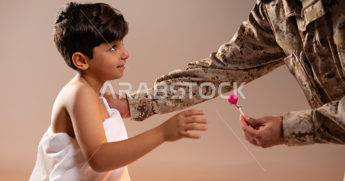 Sharing a wonderful military atmosphere with a boy, offering candy to ...