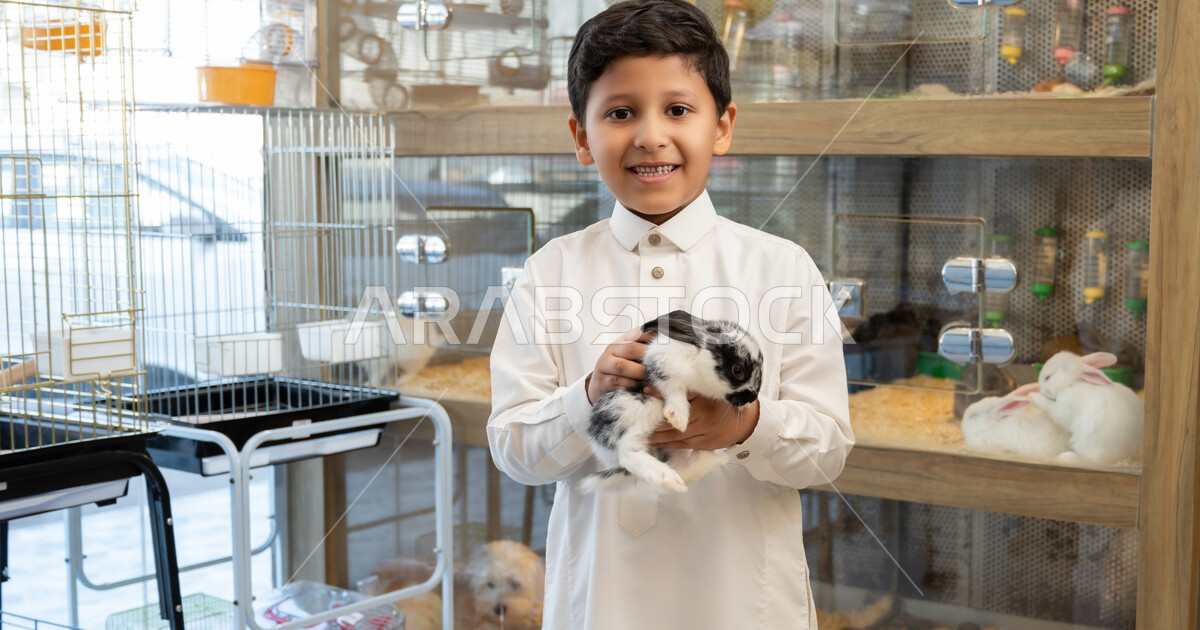 The concept of animal kindness and compassion, a smiling Saudi Gulf ...