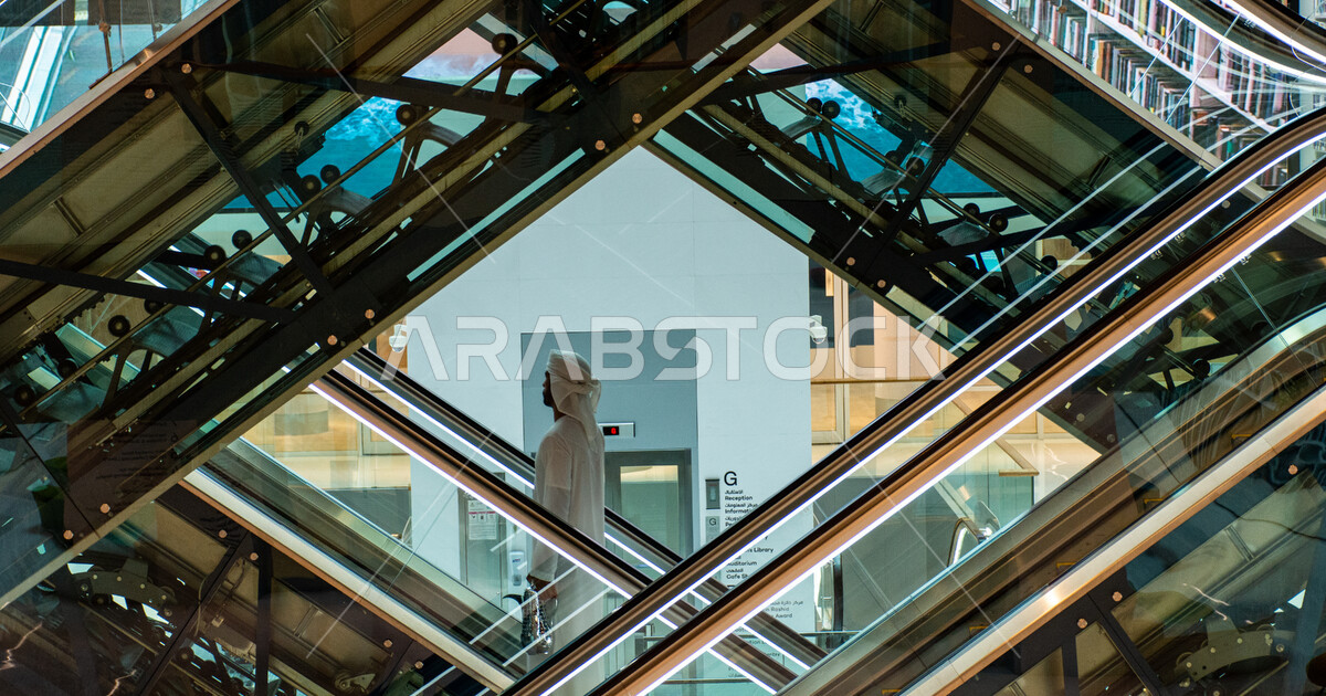 Providing comfort for readers, an Emirati Gulf Arab citizen stands on ...