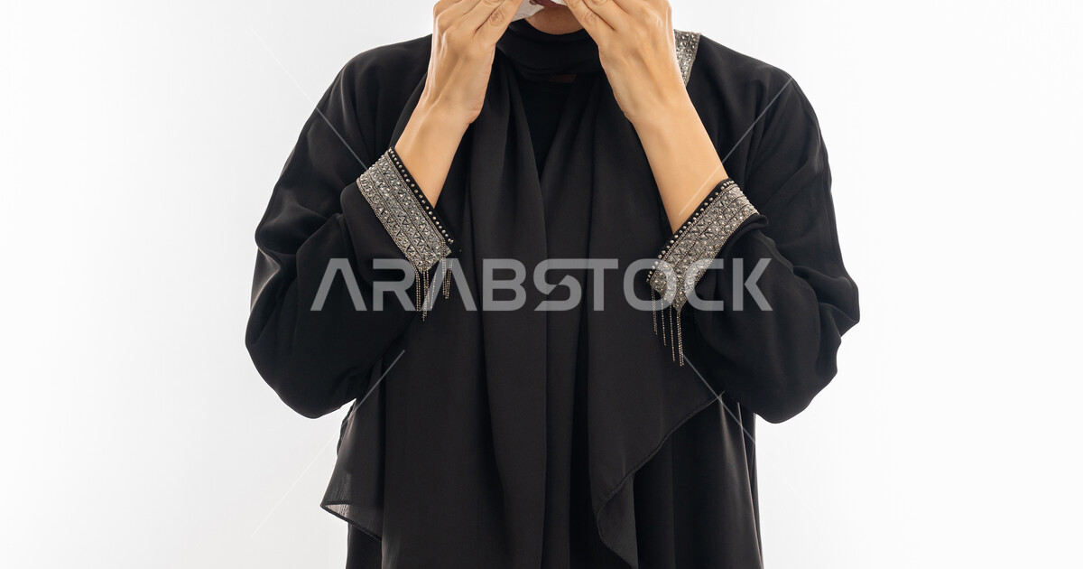Using tissues while sneezing, catching a cold and flu, Saudi woman ...
