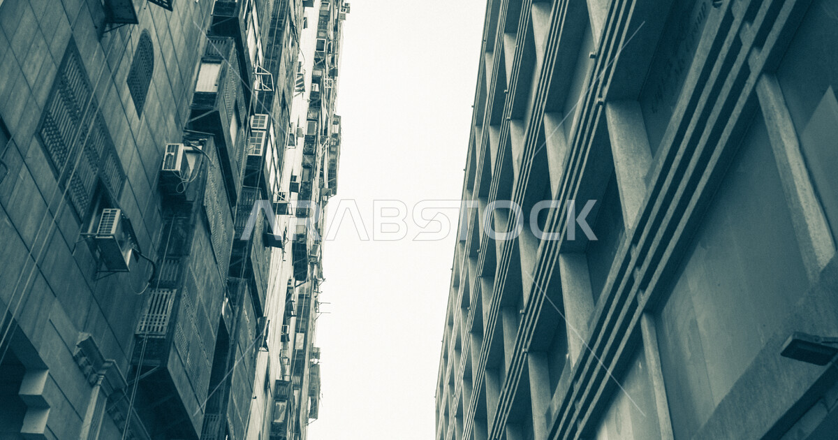 A wonderful picture of a corridor between two apartment buildings in ...