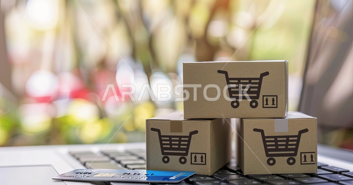 The concept of online shopping, a close-up of cardboard shopping boxes ...