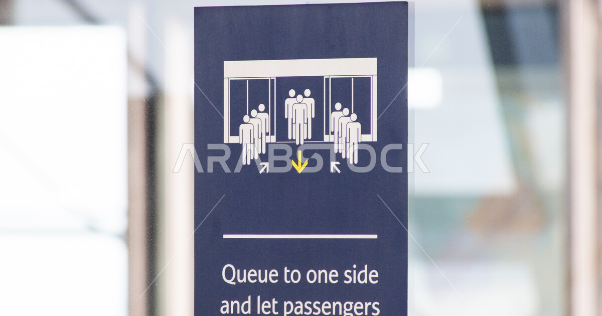 Notes and posters on the Dubai Metro gate, a note in English about ...