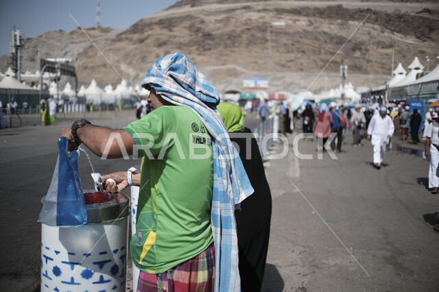 Providing water to pilgrims continuously in hot weather, Hajj season in ...