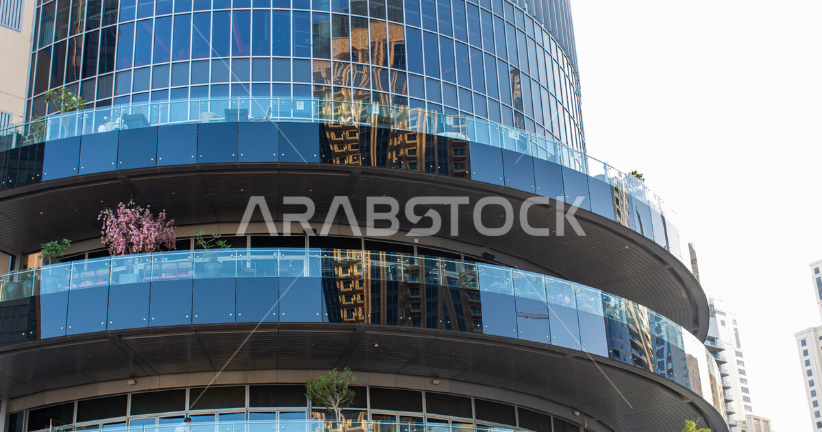 Reflective glass floors of a skyscraper in Dubai Marina, cutting-edge ...
