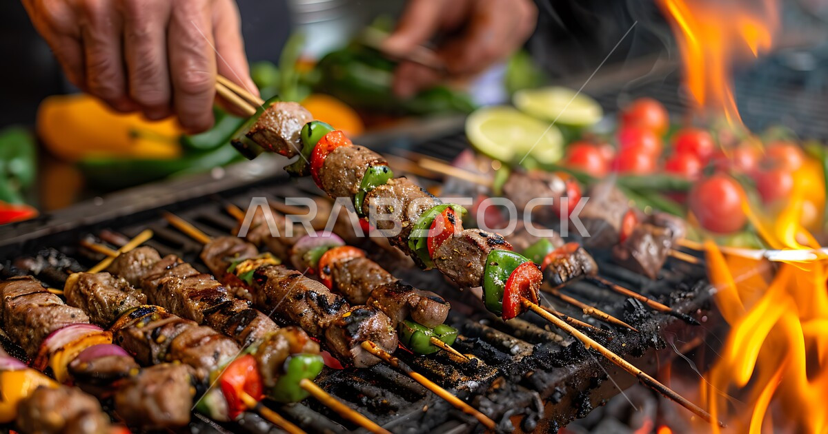 Enjoying a barbecue party, Close-up of the hand of a Saudi Arabian Gulf ...