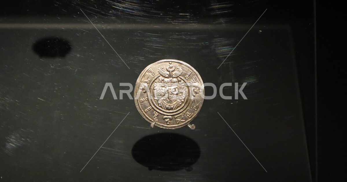 An ancient Islamic gold coin on display at the Biennale Museum of ...