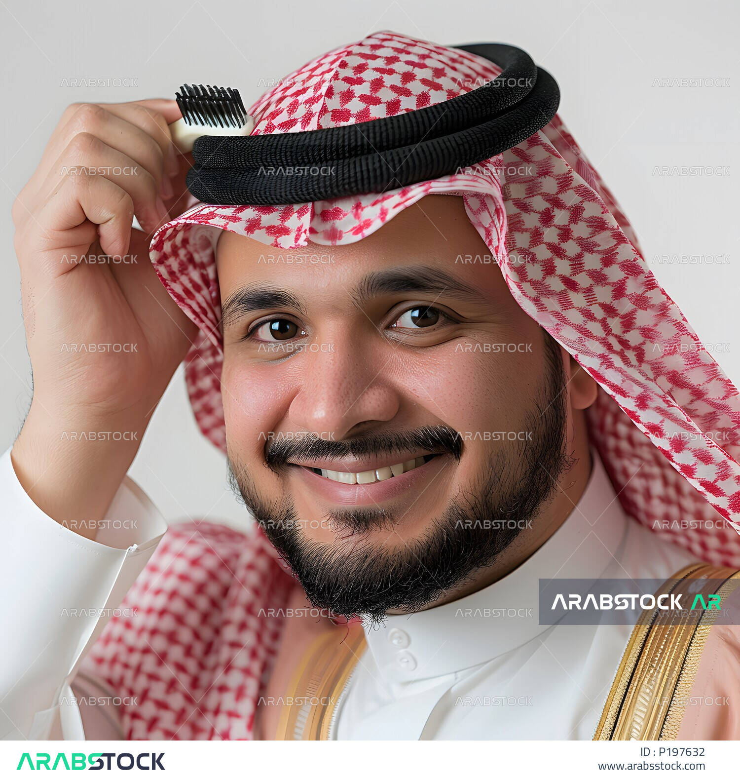 Caring about appearance, portrait of an Arab Gulf Emirati man wearing ...