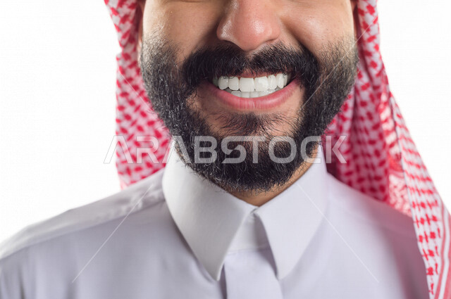 A close-up of a smile on the face of a Saudi Arabian Gulf man, cosmetic ...