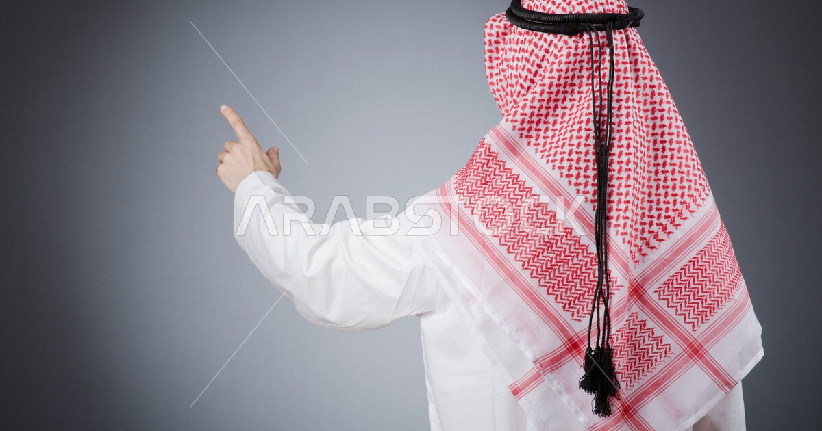 Pointing to something with gestures of identification and emphasis ...