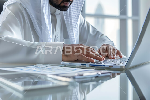 Remote business management, Close-up of an Arab Gulf Emirati employee ...