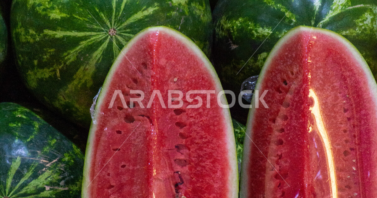 Red watermelon fruit in the vegetable and fruit market in the Deira ...