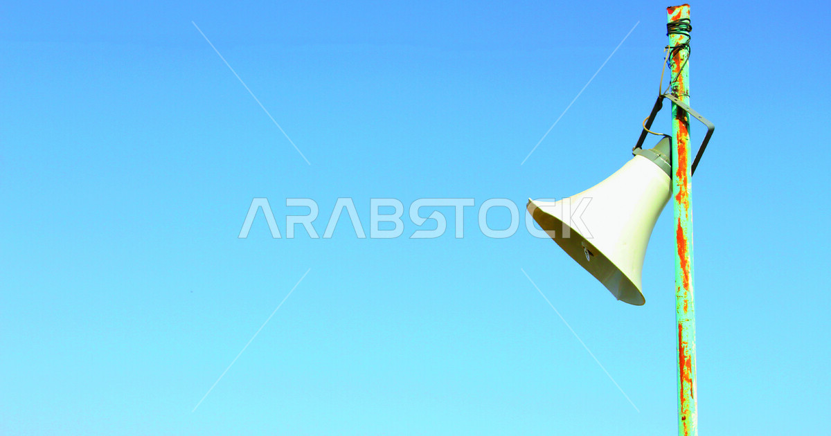 A loudspeaker hanging on a pillar in a mosque, a loudspeaker for the ...