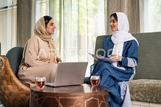 Saudi Arabian Gulf women using their laptop, business women, business ...