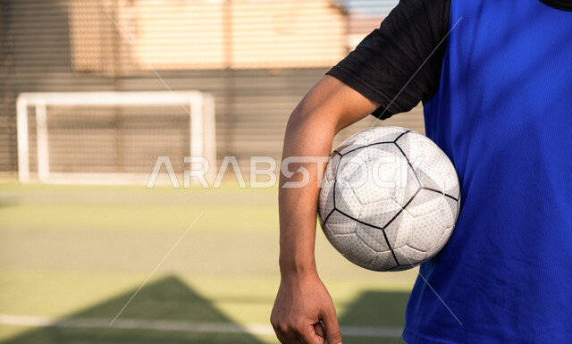 Close-up of a Saudi Gulf football player, within the borders of the ...