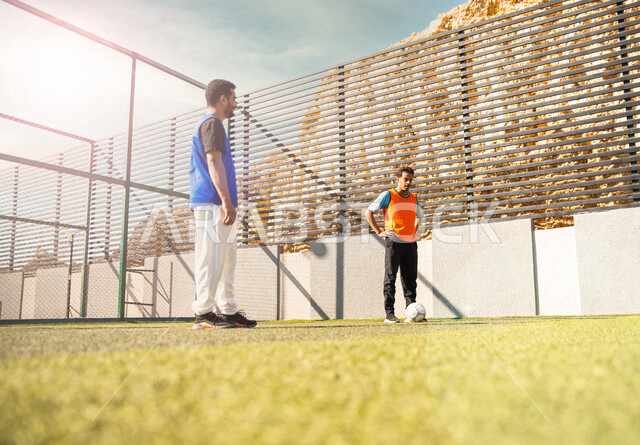 A young Arab Saudi Arabian Gulf, football player, practice football ...