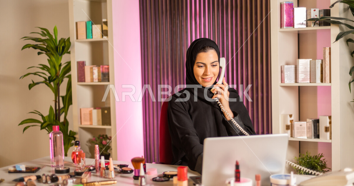 A veiled Saudi Arabian Gulf makeup saleswoman, an expert in cosmetics ...
