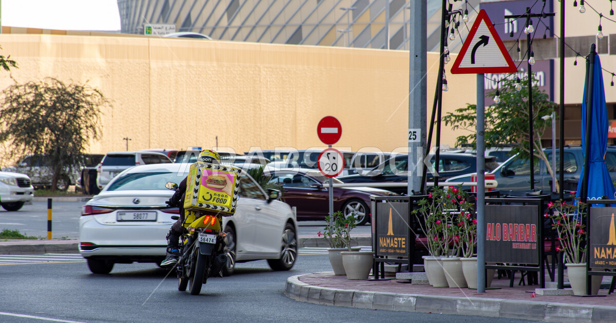 Reliable and secure order delivery in UAE, Back view of an Emirati Gulf ...