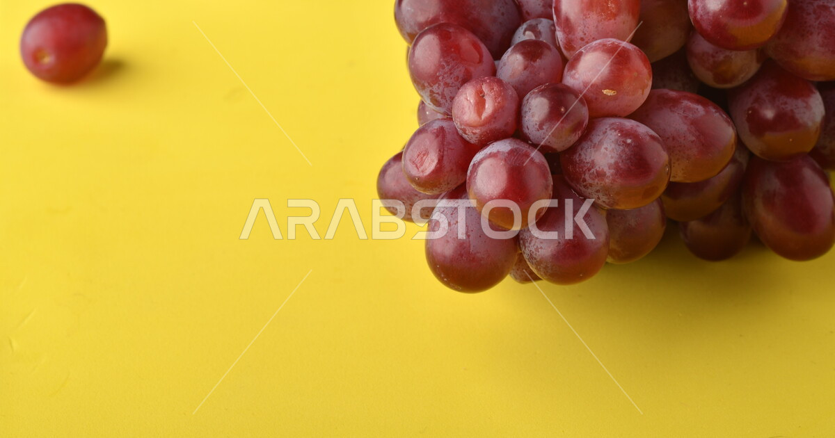 Delicious purple grape fruit pictured on yellow background, delicious ...