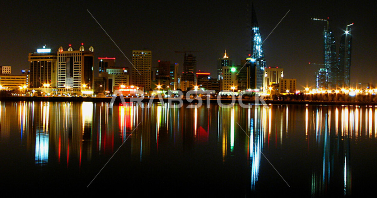 Reflection of lights on the sea water in Manama, architectural art of ...