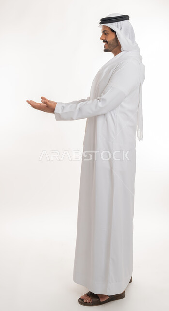 Presenting and displaying something, portrait from the side of a ...