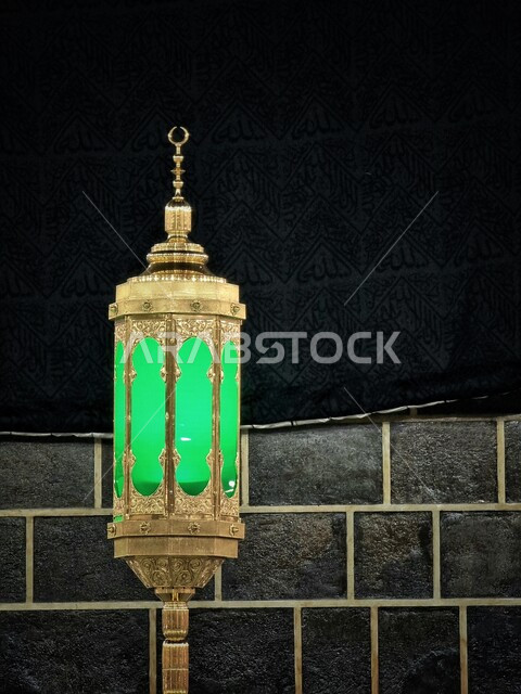 Close-up of the green light and the Holy Kaaba Mosque in Mecca during ...